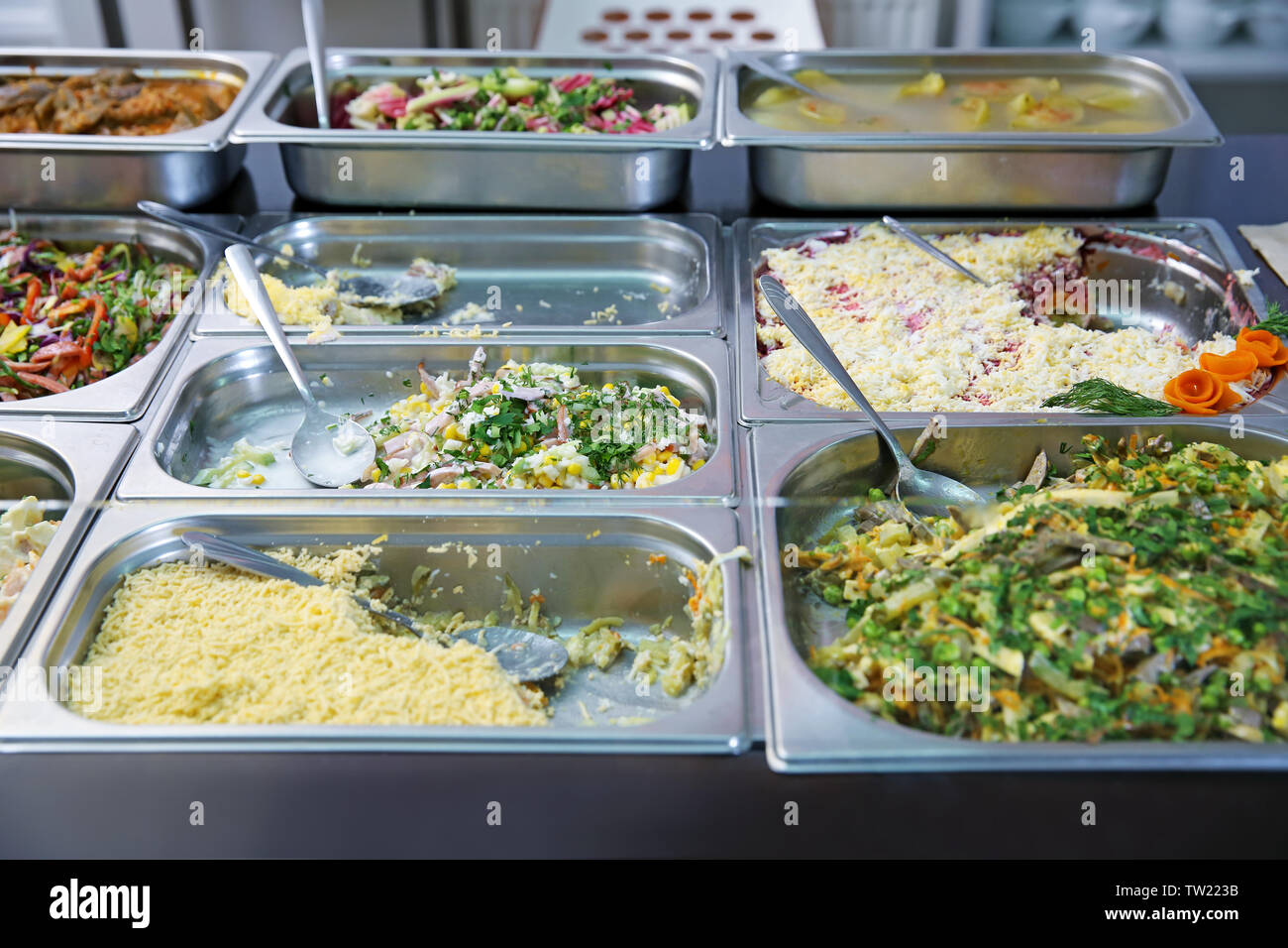 Steel self service trays filled with delicious food Stock Photo - Alamy