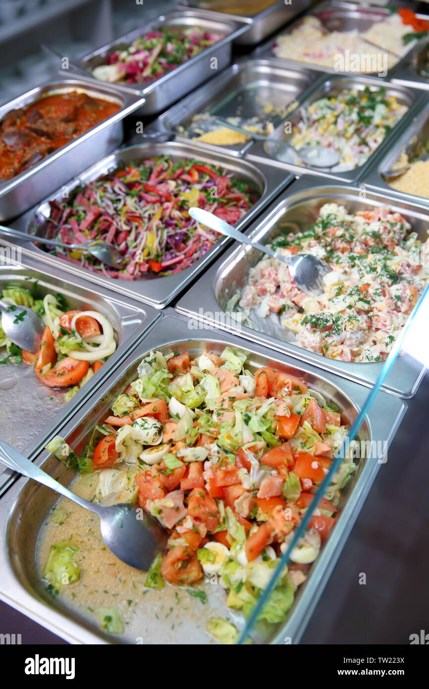 Steel self service trays filled with delicious food Stock Photo - Alamy