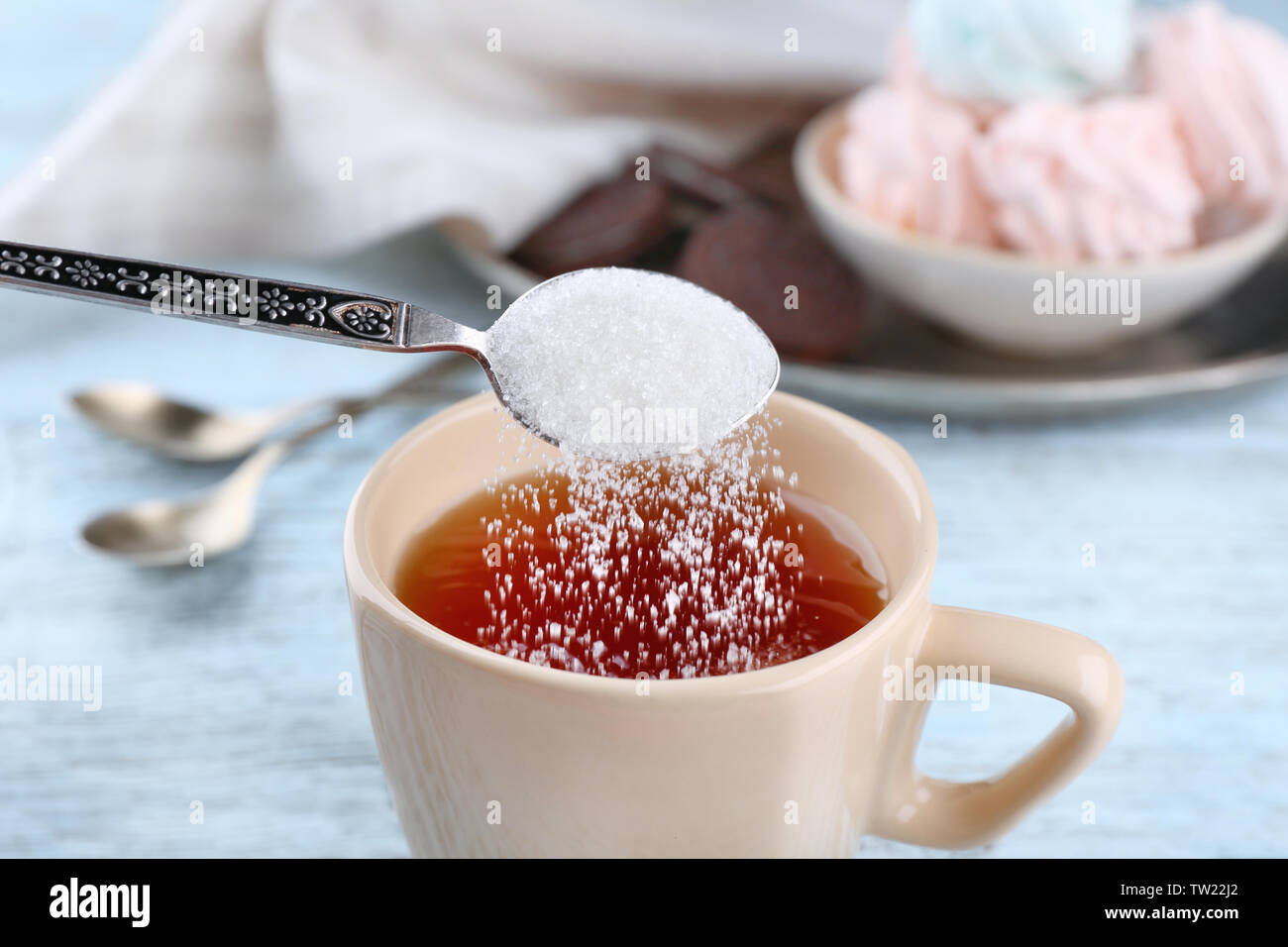 Sugar spoon tea adding hi-res stock photography and images - Alamy