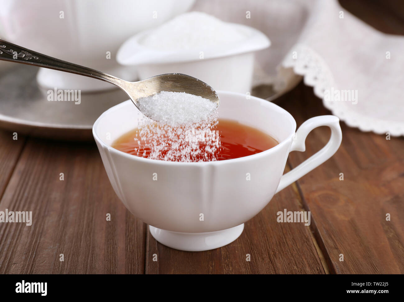 Sugar spoon tea adding hi-res stock photography and images - Alamy