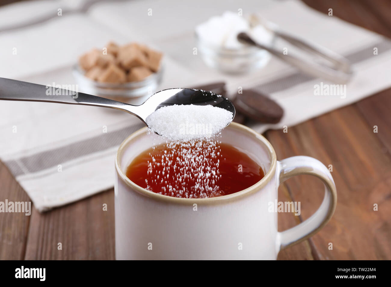 Sugar spoon tea adding hi-res stock photography and images - Alamy