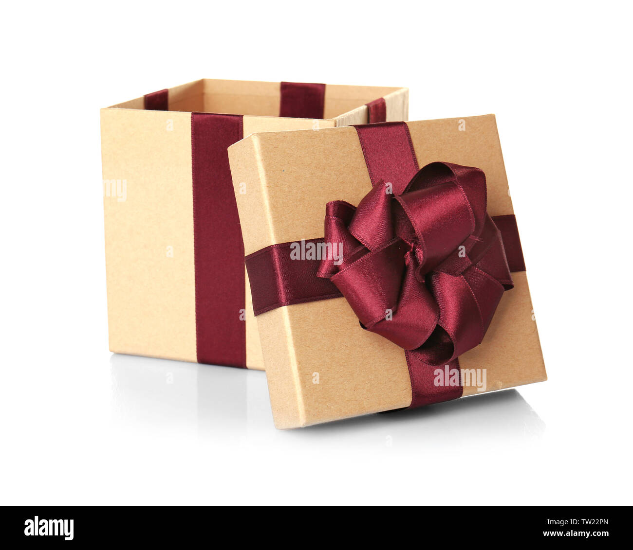 Open beige gift box with vinous ribbon on white background Stock Photo ...