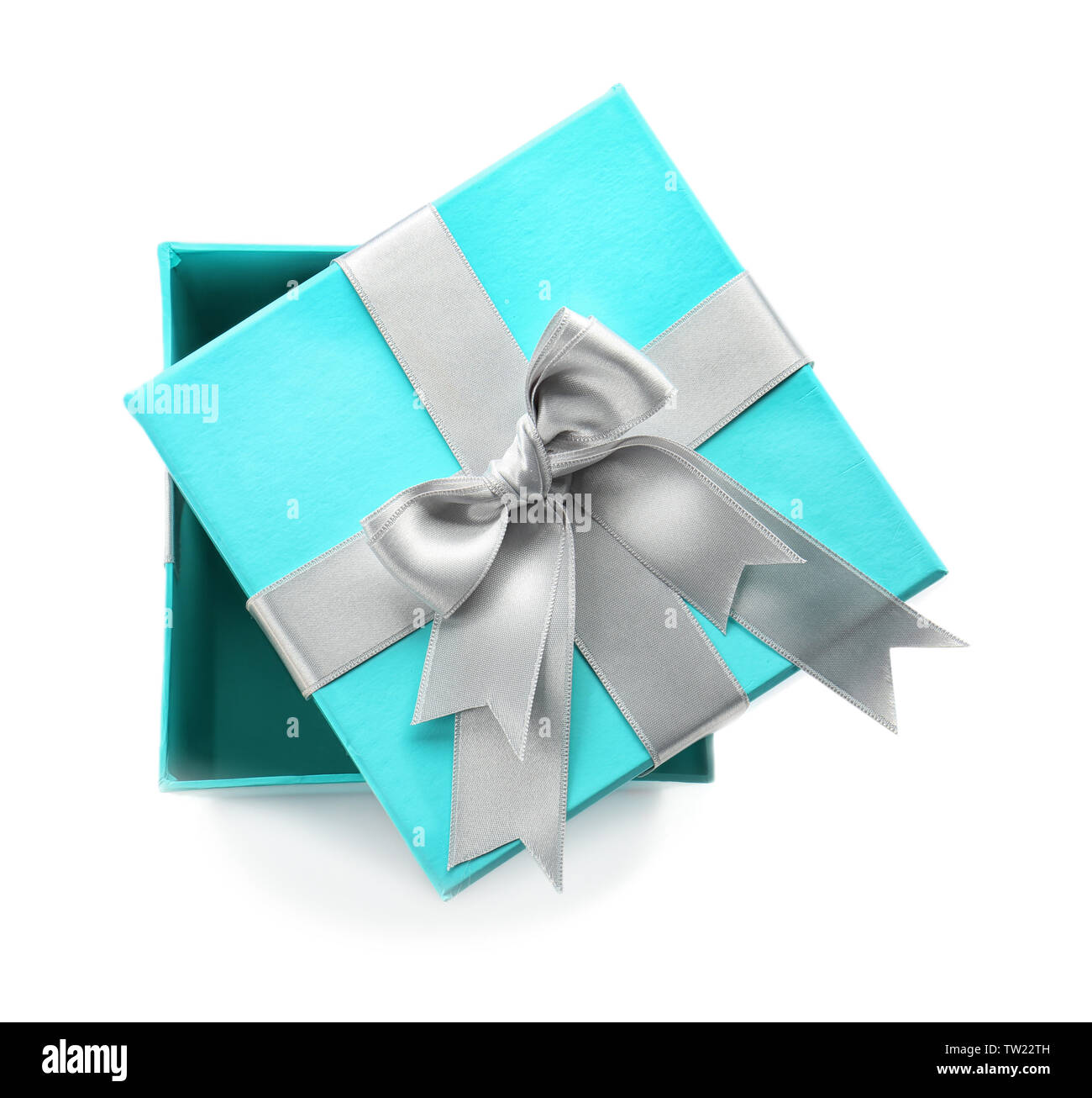 Open turquoise gift box with silver ribbon on white background Stock ...