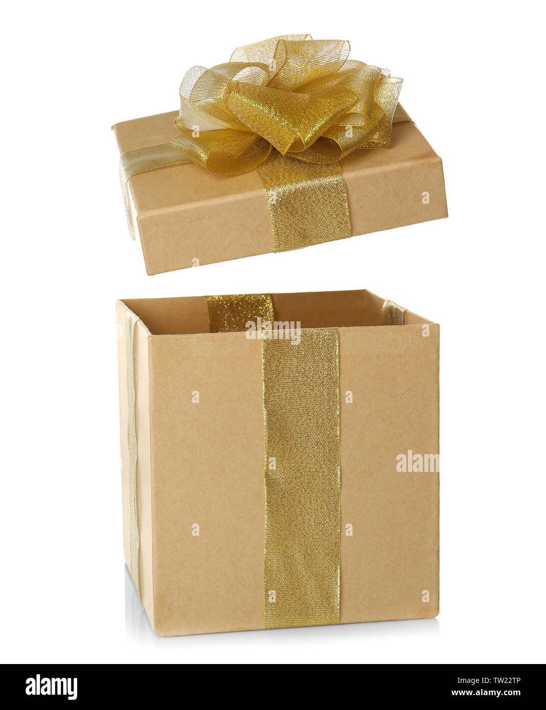 Open beige gift box with golden ribbon on white background Stock Photo ...