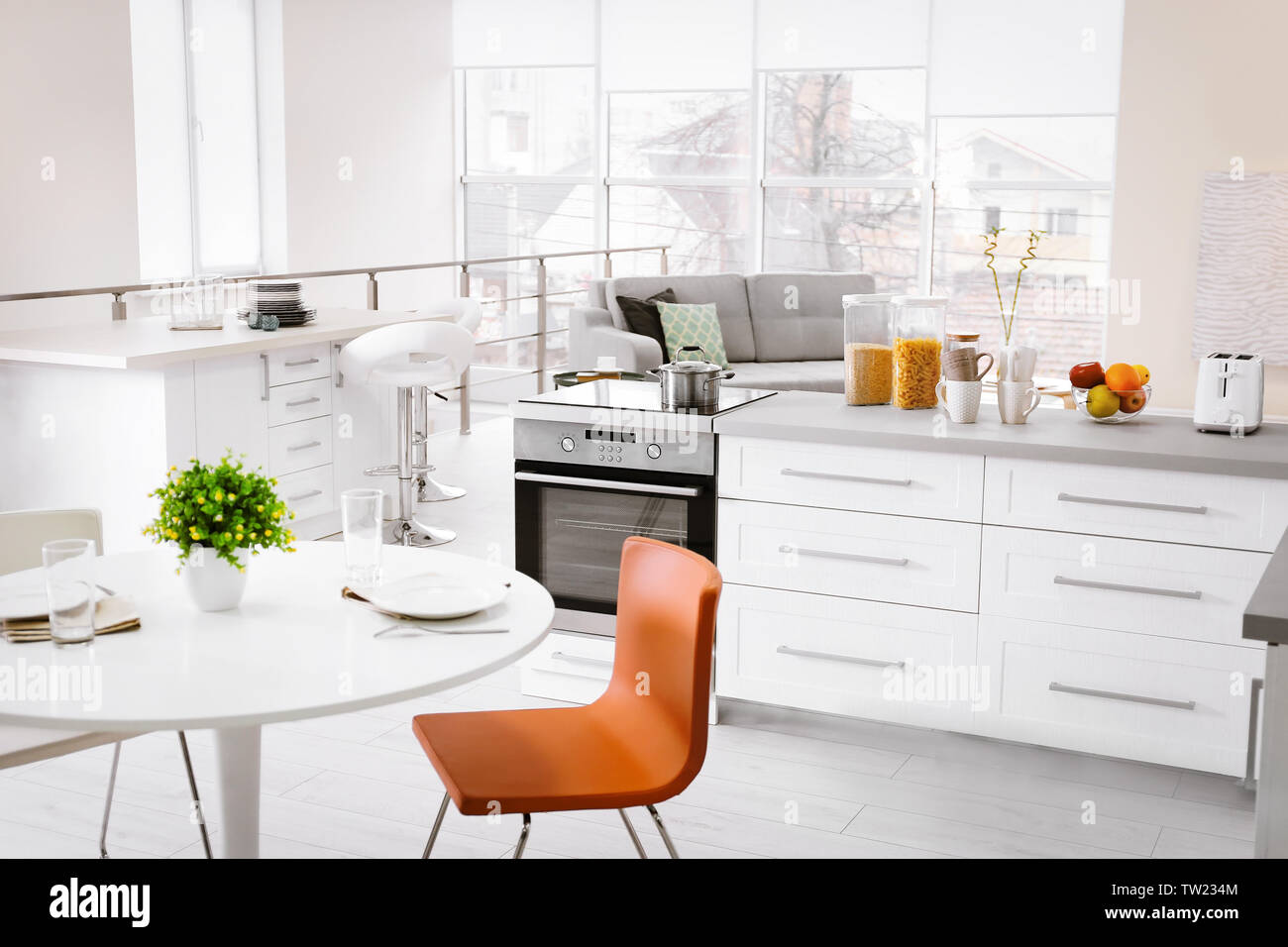 Modern kitchen interior of studio apartment with large counter and ...