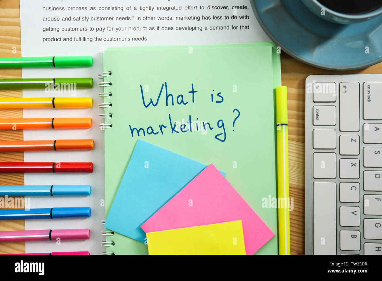 Notebook with text WHAT IS MARKETING on table Stock Photo - Alamy