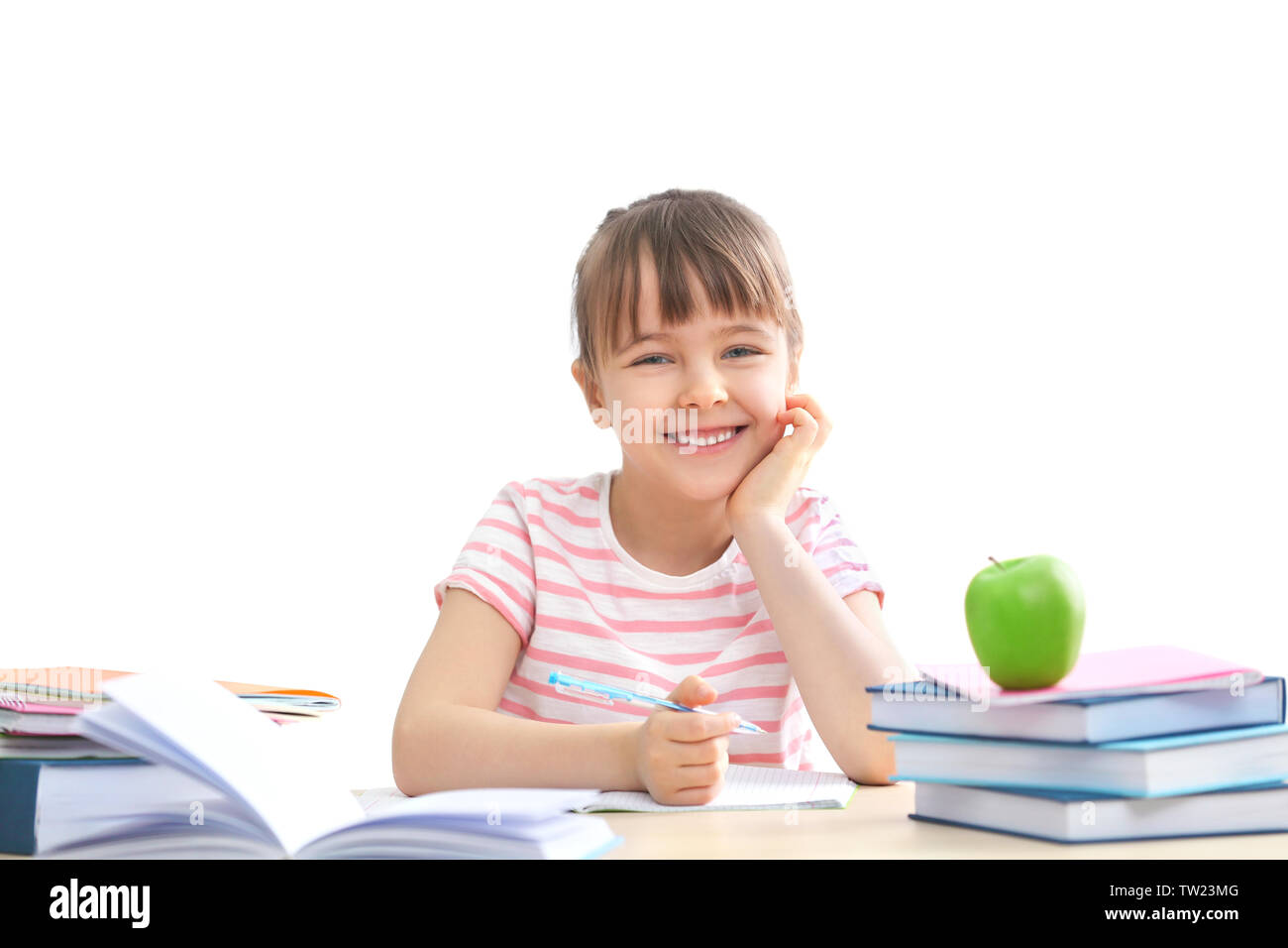 Happy schoolgirl studying at table on white background Stock Photo - Alamy