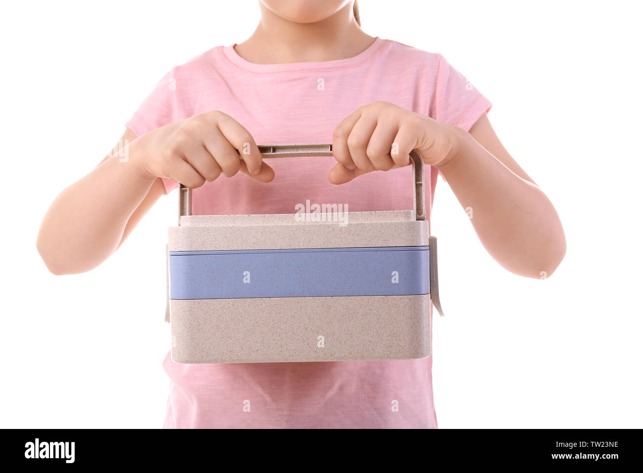 Schoolgirl holding lunch box on white background Stock Photo - Alamy