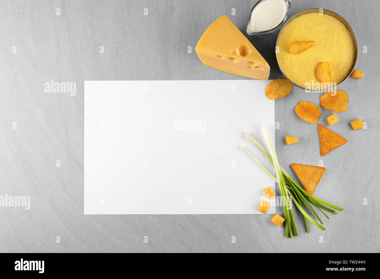 Still life with food ingredients and blank paper on table Stock Photo ...