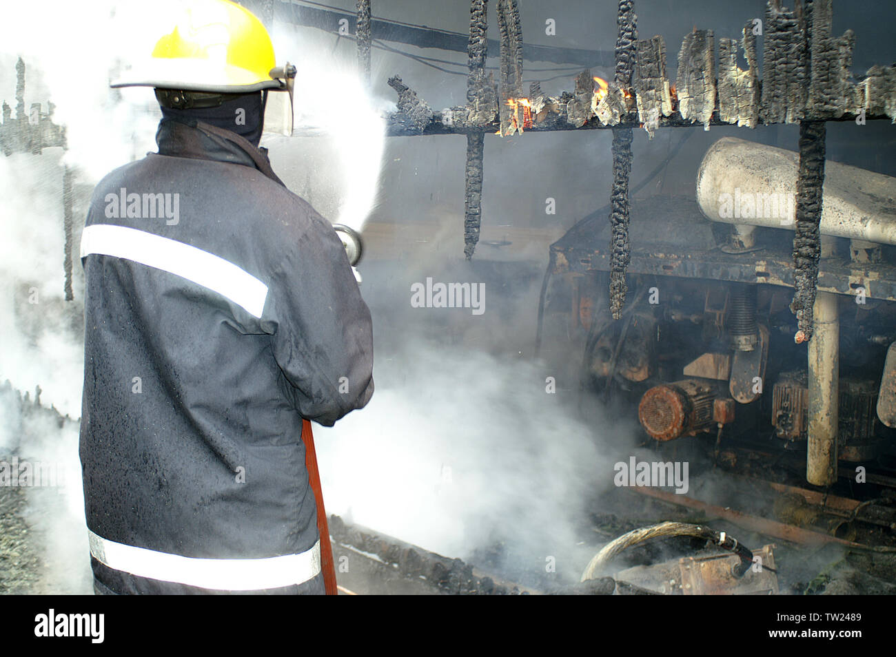 Female fire fighter with hose hi-res stock photography and images - Alamy