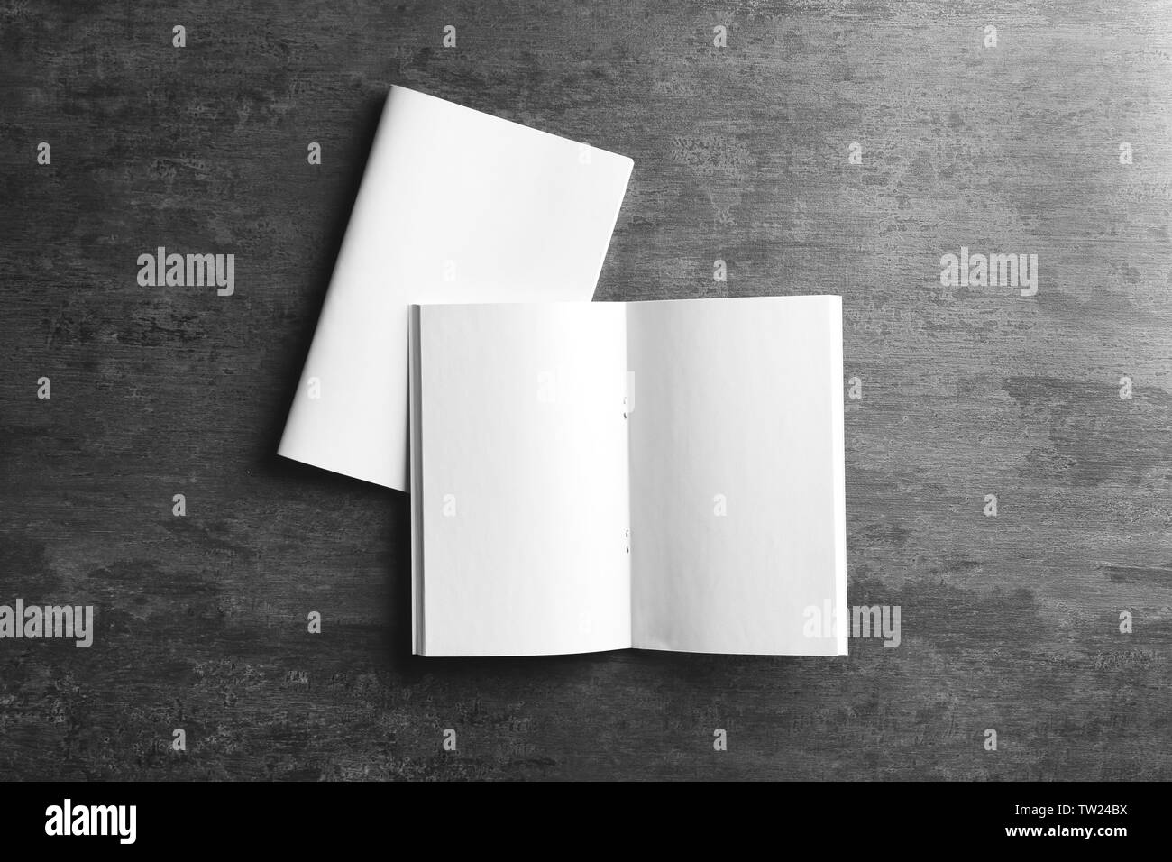 Blank brochure on dark texture background Stock Photo - Alamy