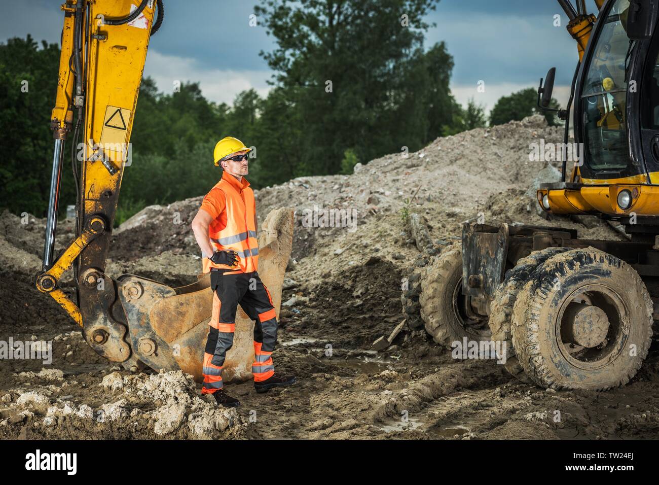 Excavation Construction Ground Works. Caucasian Contractor and the ...