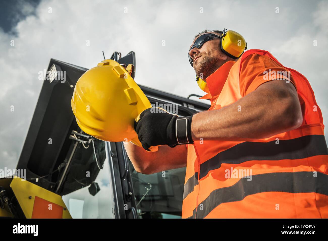 Caucasian Construction Contractor Wearing Protection Accessories. Hard ...