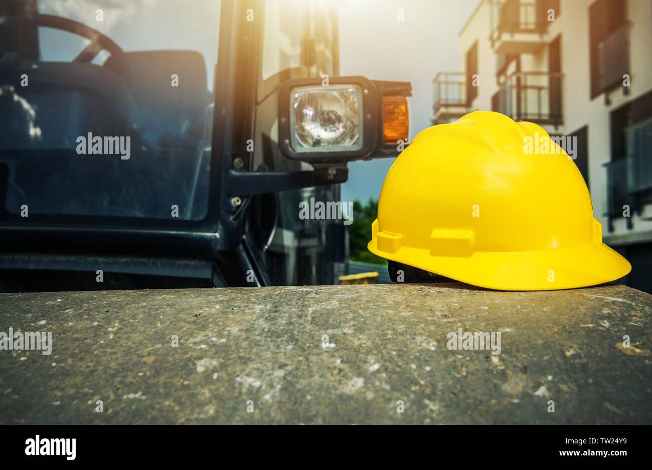 Yellow Hard Hat on the Construction Roller. Heavy Equipment Operation ...