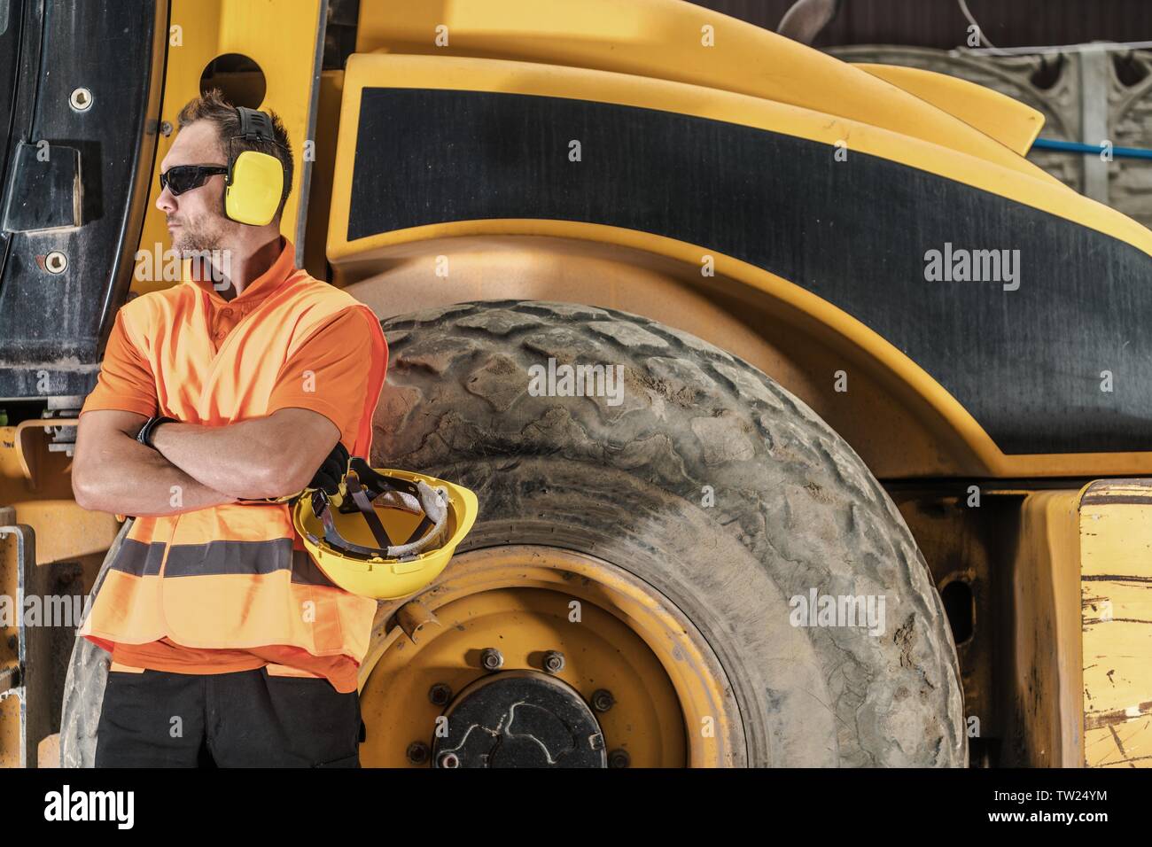 Caucasian Heavy Construction Equipment Operator. Road Building ...