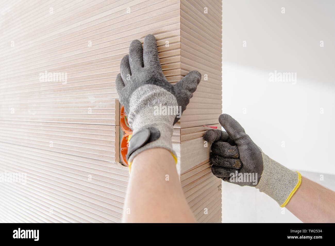 Modern Ceramic Tiles Installation Closeup Photo. Bathroom Remodeling ...