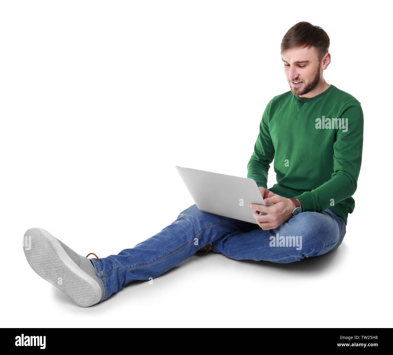 Young programmer using laptop on white background Stock Photo - Alamy