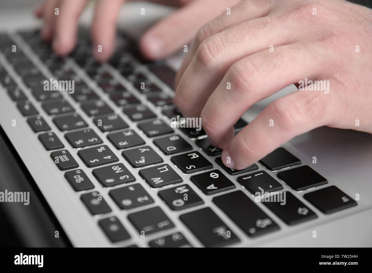Male hands on laptop keyboard, closeup Stock Photo - Alamy