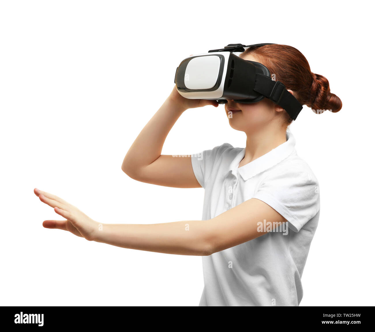 Portrait of little girl having fun with virtual reality headset on ...