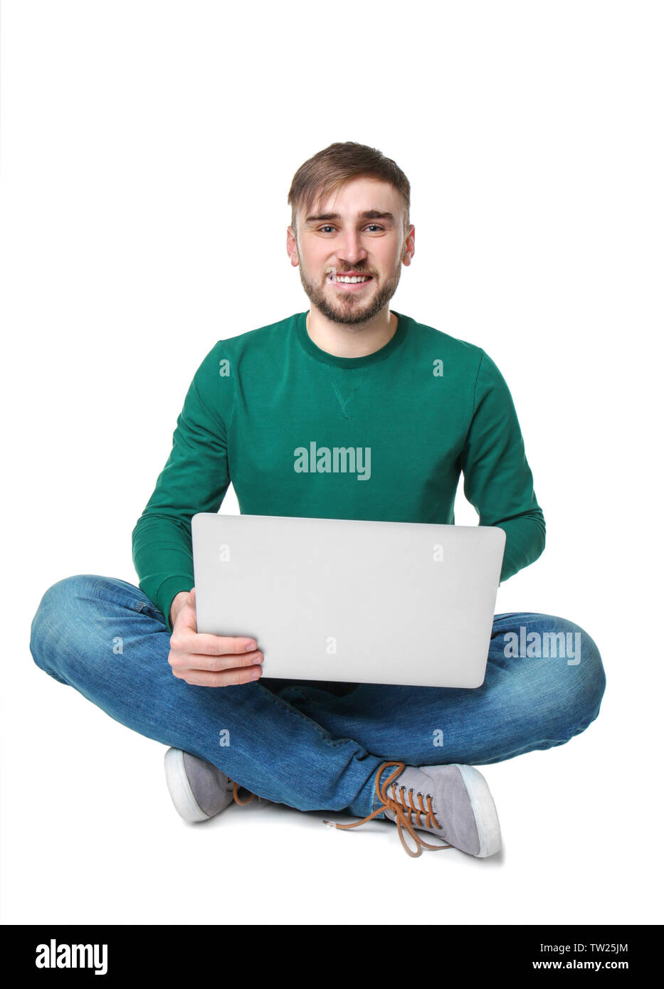 Young programmer using laptop on white background Stock Photo - Alamy