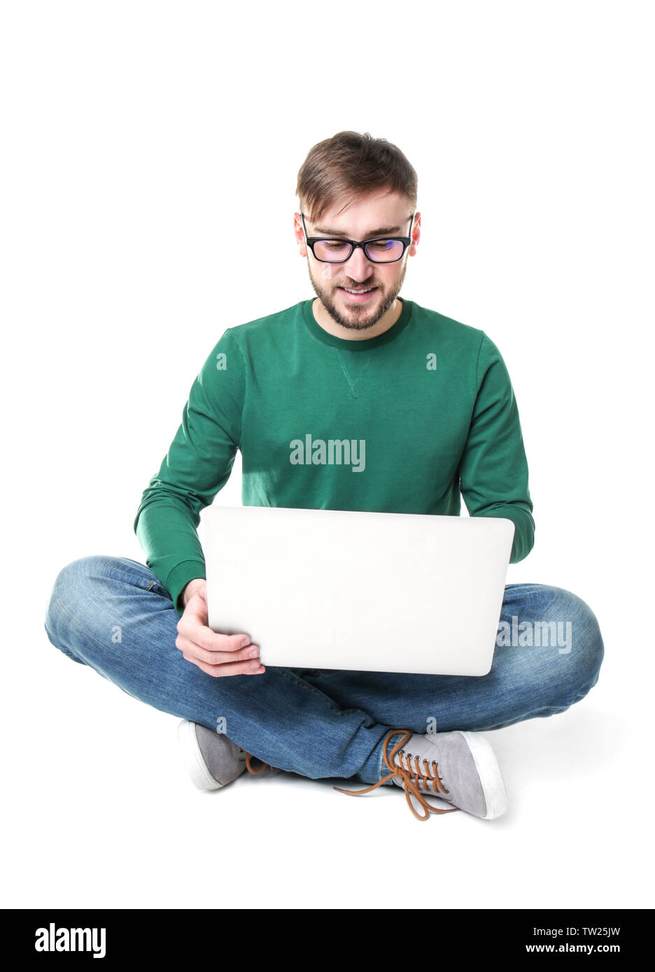 Young programmer using laptop on white background Stock Photo - Alamy