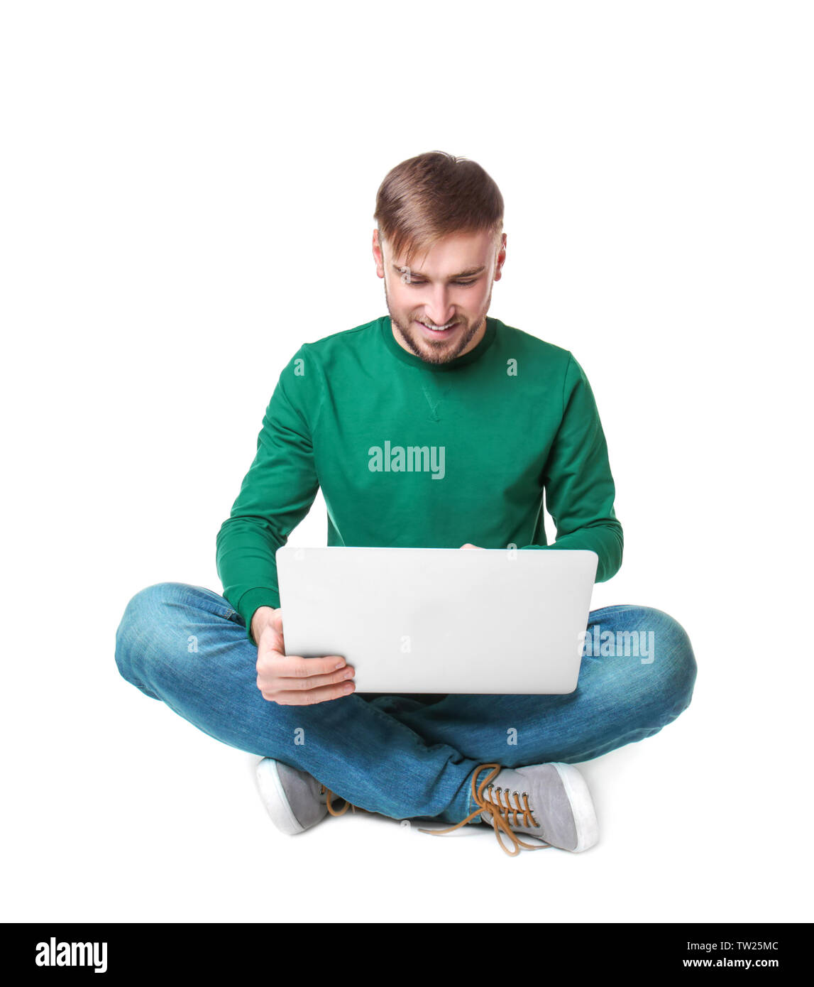 Young programmer using laptop on white background Stock Photo - Alamy