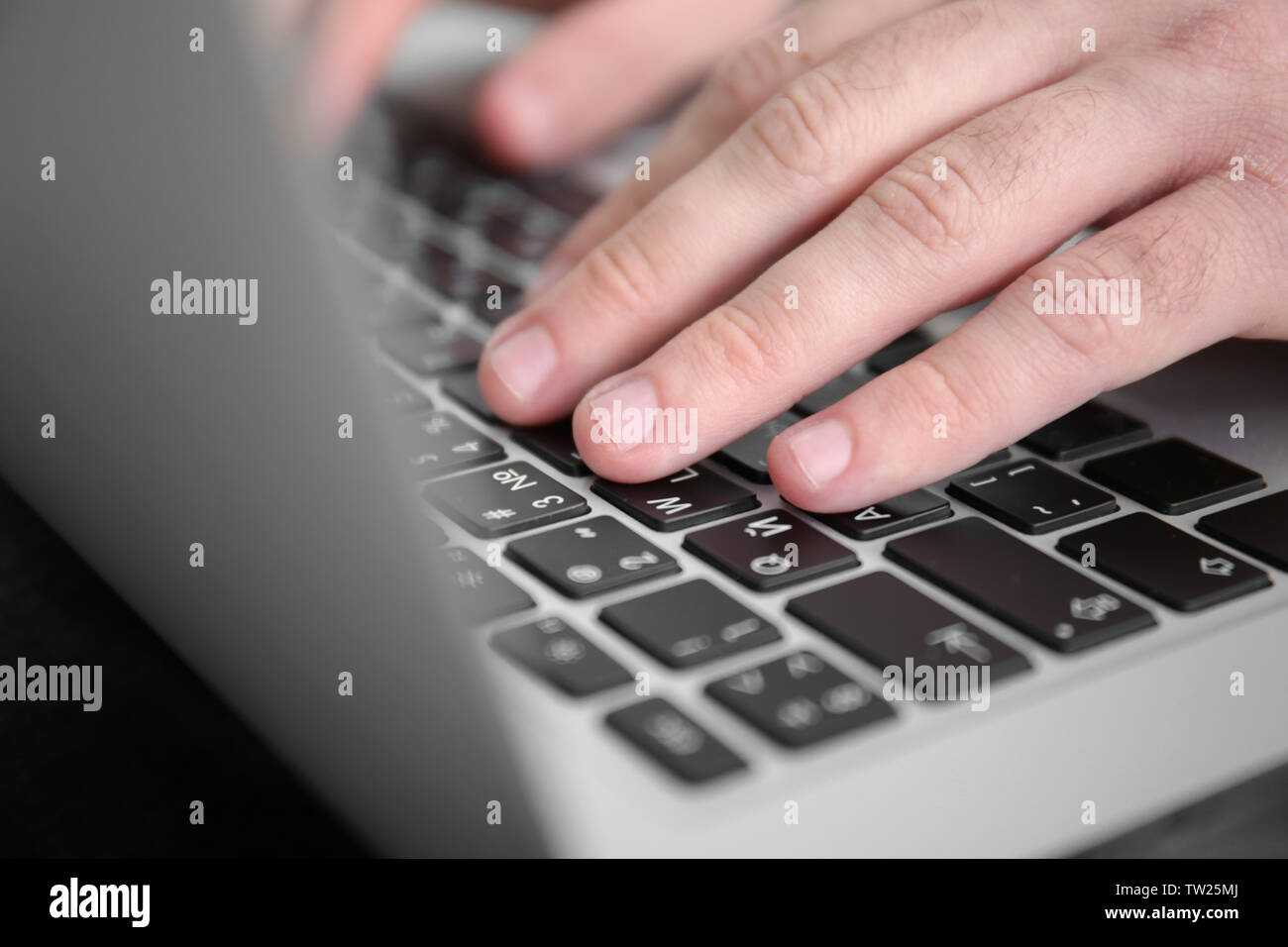 Male hands on laptop keyboard, closeup Stock Photo - Alamy