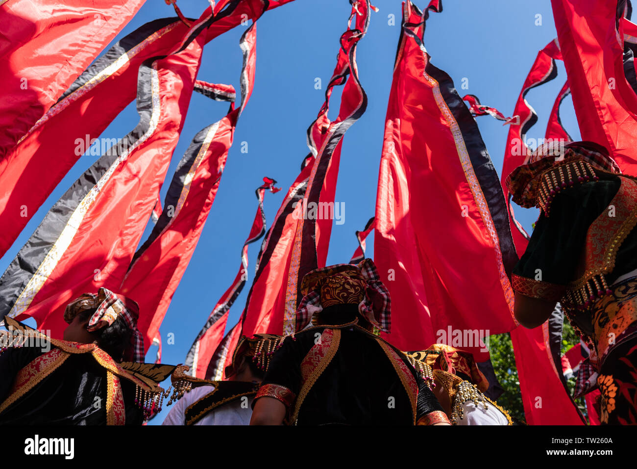 The red pennant dancers, wearing traditional Balinese costumes, prepare ...