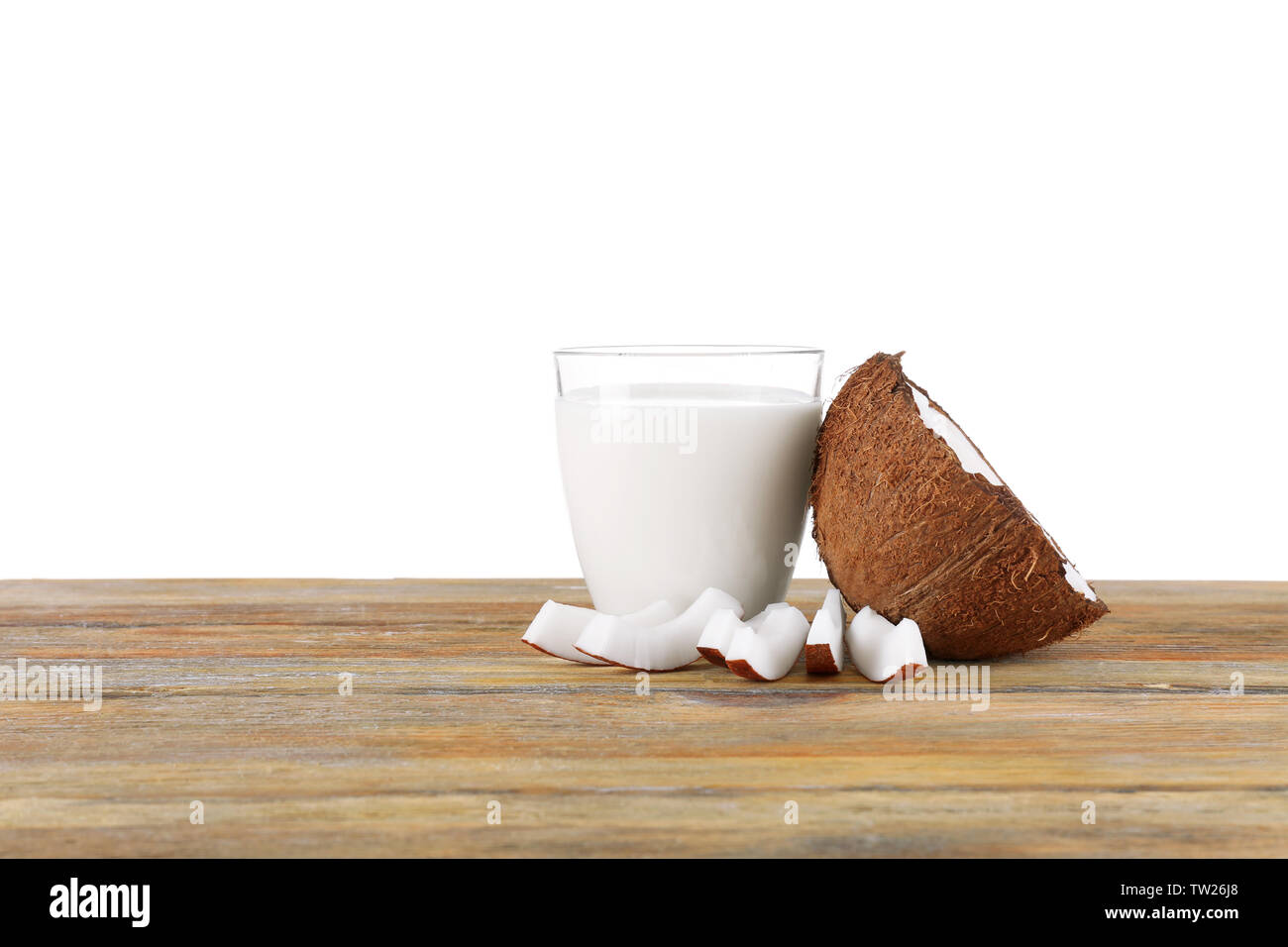 Glass of coconut milk and fresh nut on white background Stock Photo - Alamy