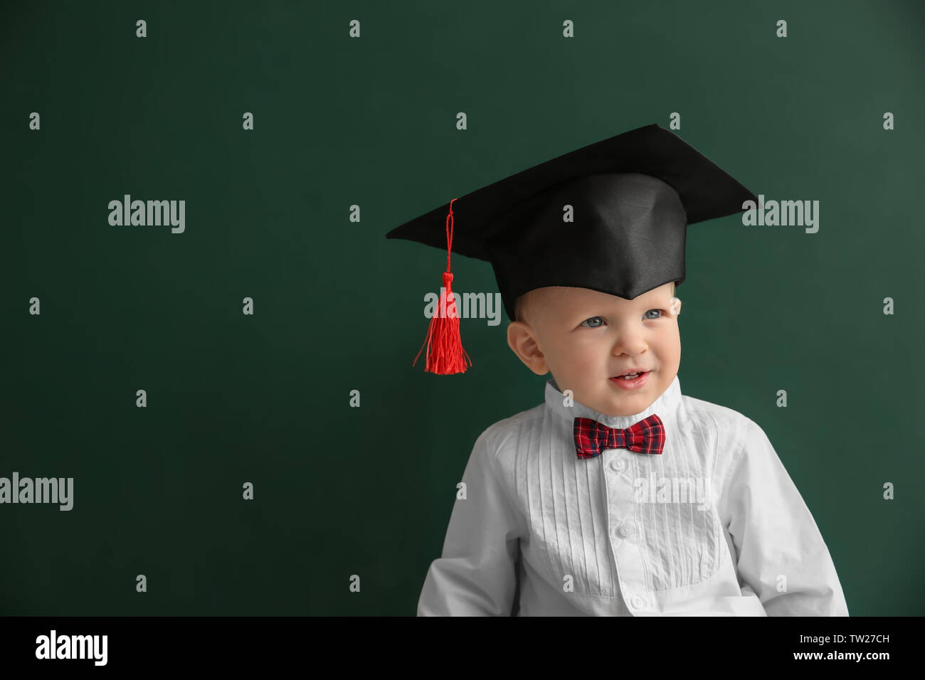 Cute little boy with magister hat and blackboard on background Stock ...