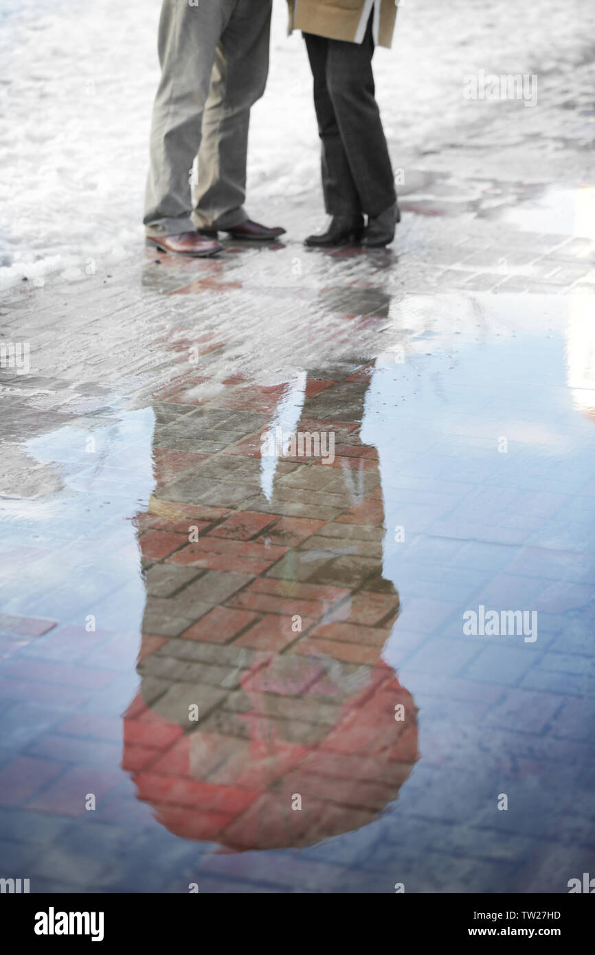 Couple water puddle reflection hi-res stock photography and images - Alamy