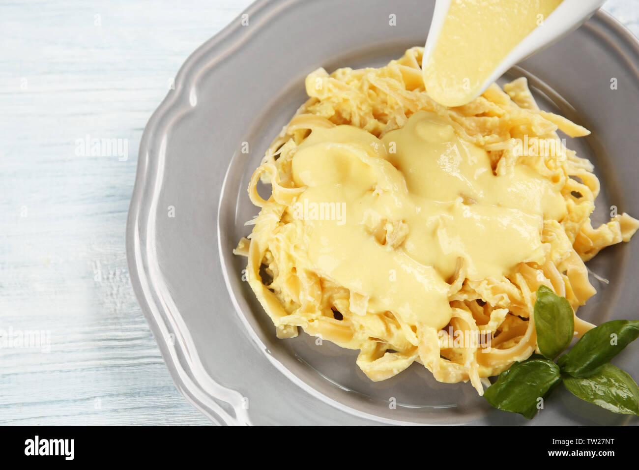 Adding the sauce hi-res stock photography and images - Alamy