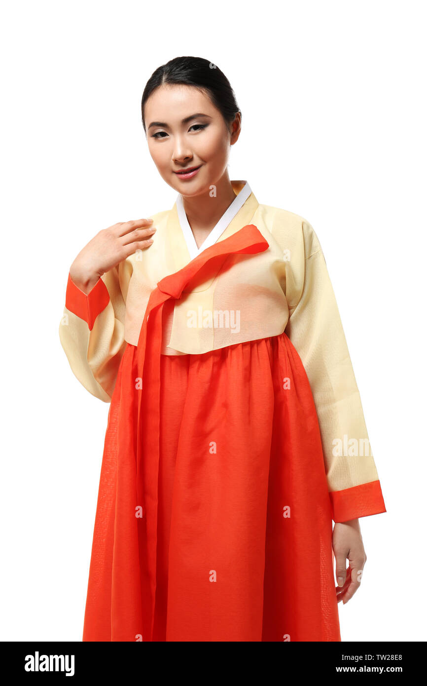 Beautiful young woman dressed in traditional clothing on white ...