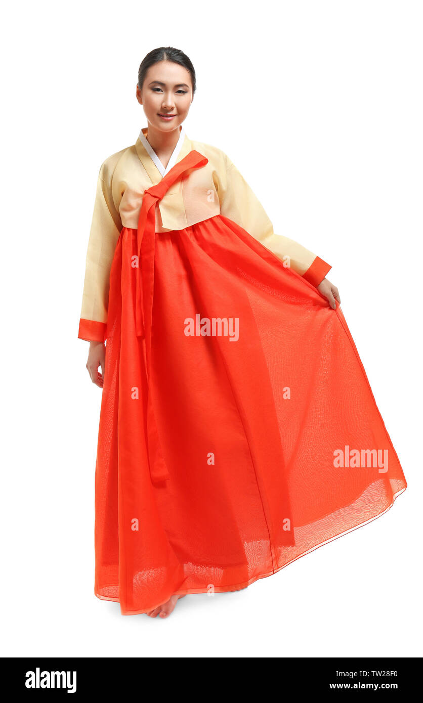 Beautiful young woman dressed in traditional clothing on white ...