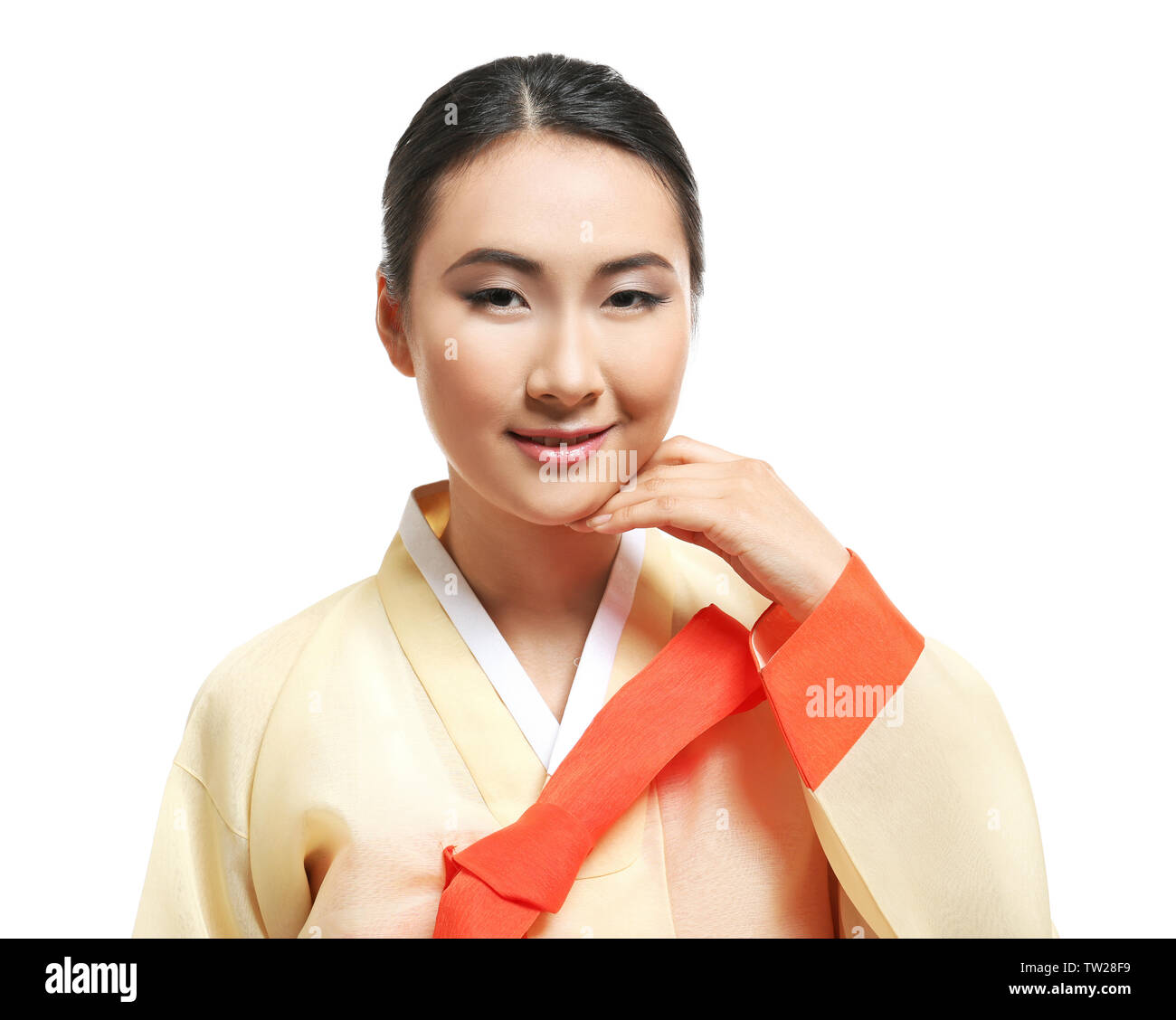 Beautiful young woman dressed in traditional clothing on white ...