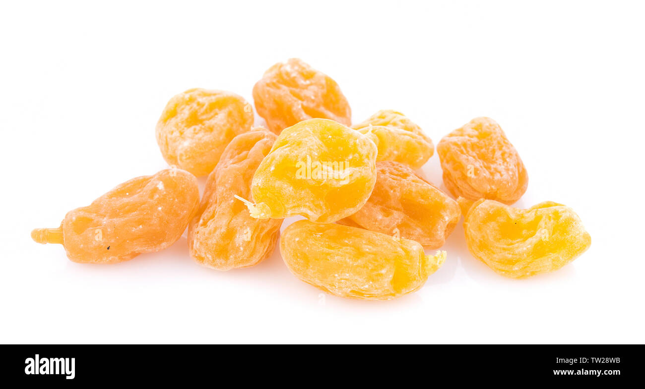 Dry yellow plums on white background Stock Photo - Alamy