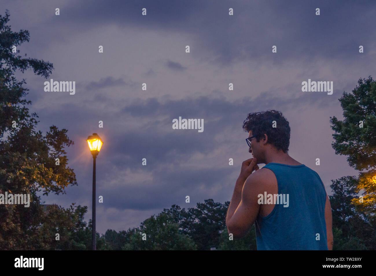 Male man person athlete thinking at night on an evening run ...