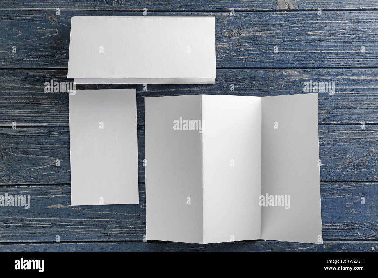 Blank brochures on wooden background Stock Photo - Alamy