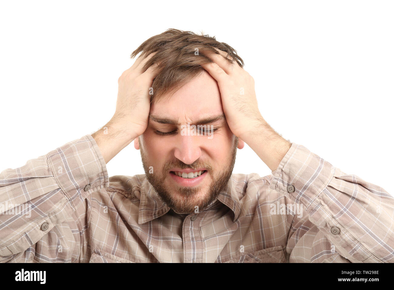 Young man suffering from headache on white background Stock Photo - Alamy