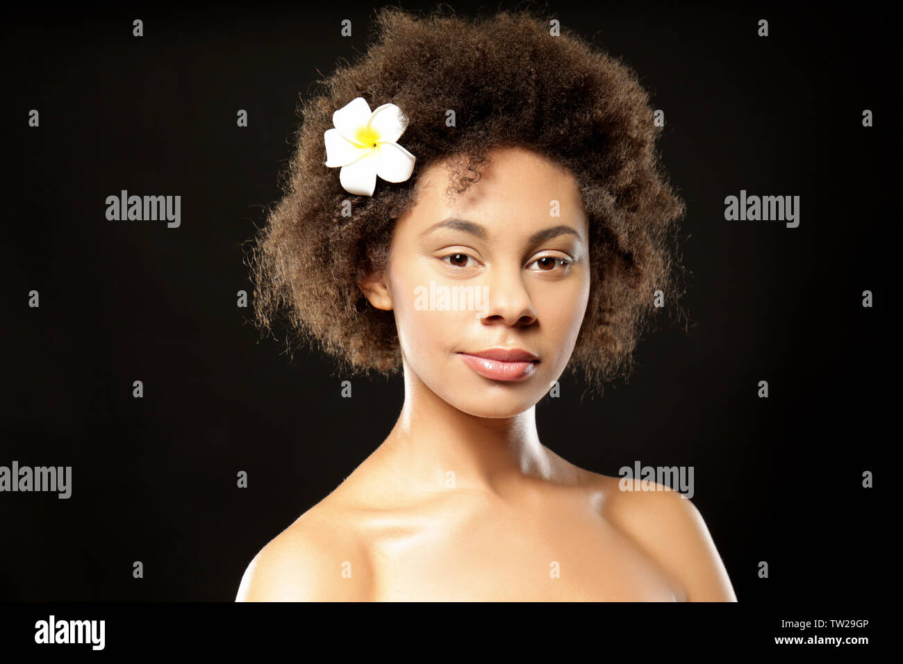 Beautiful African girl on black background Stock Photo - Alamy