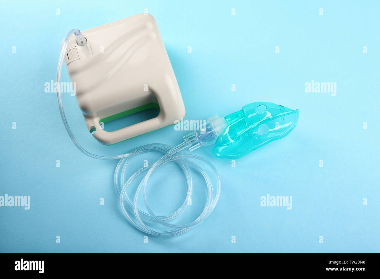Nebulizer for asthma and respiratory diseases on light background Stock ...