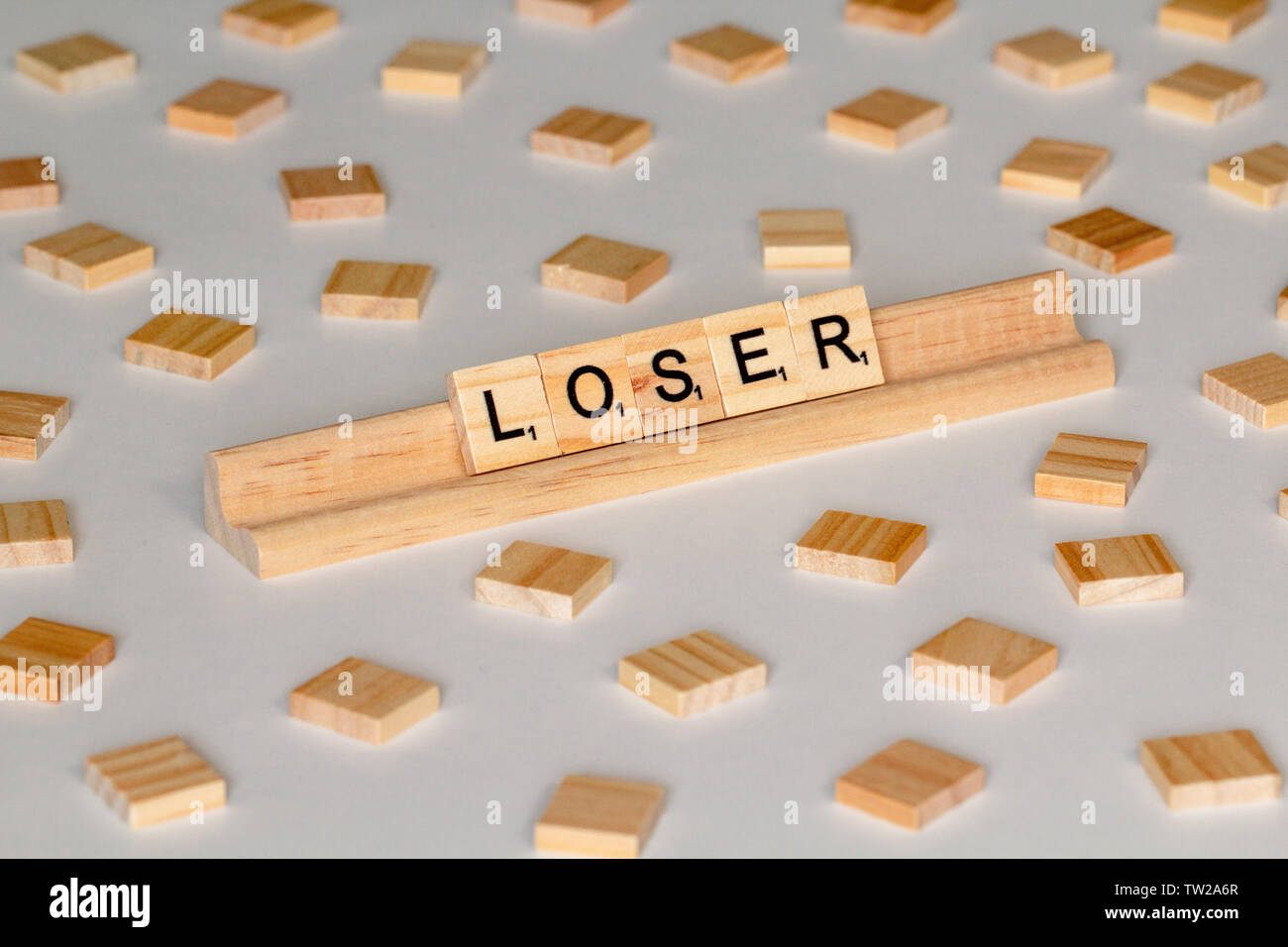 Scrabble Word Game wood tiles spelling "Loser Stock Photo - Alamy