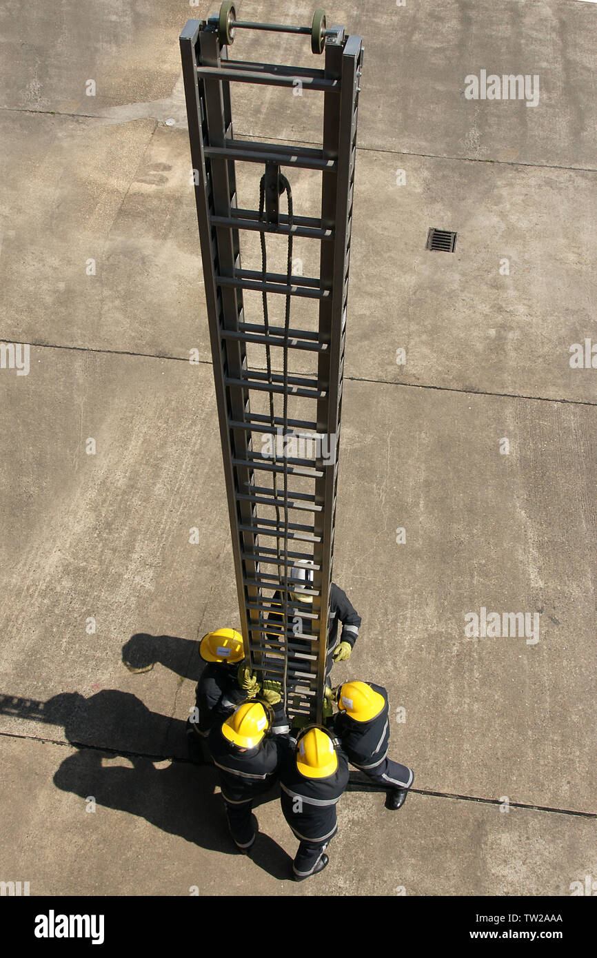 fire fighter climbing 13.5m ladder Stock Photo - Alamy