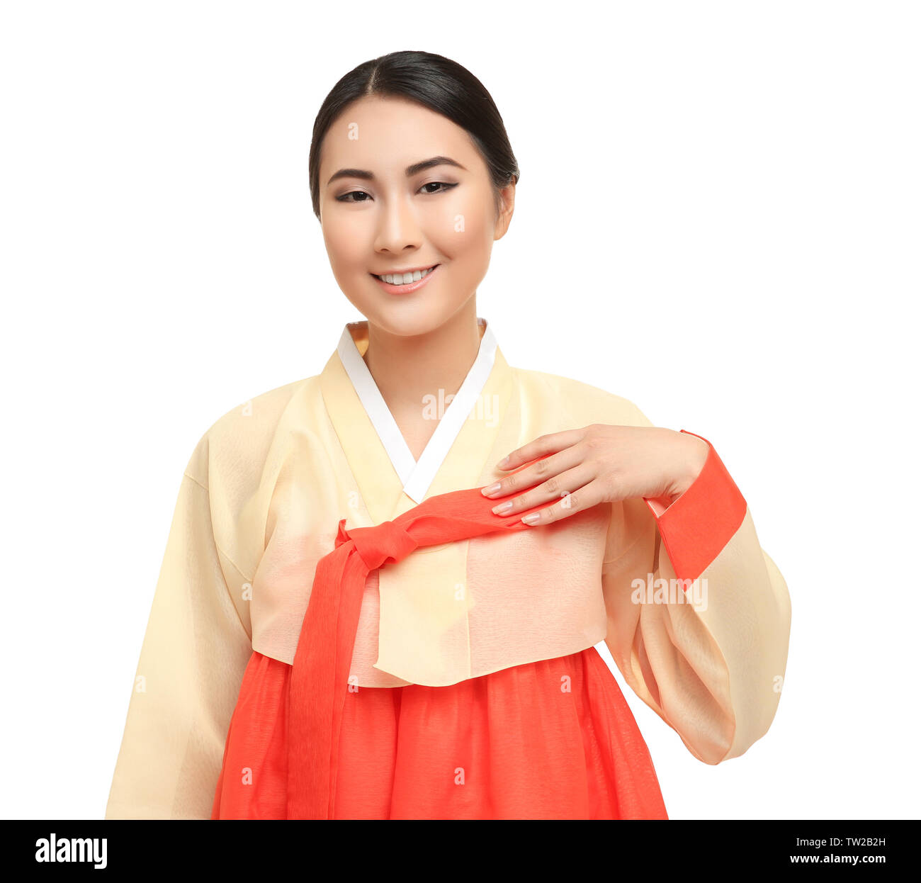 Beautiful young woman in Korean traditional costume on white background ...