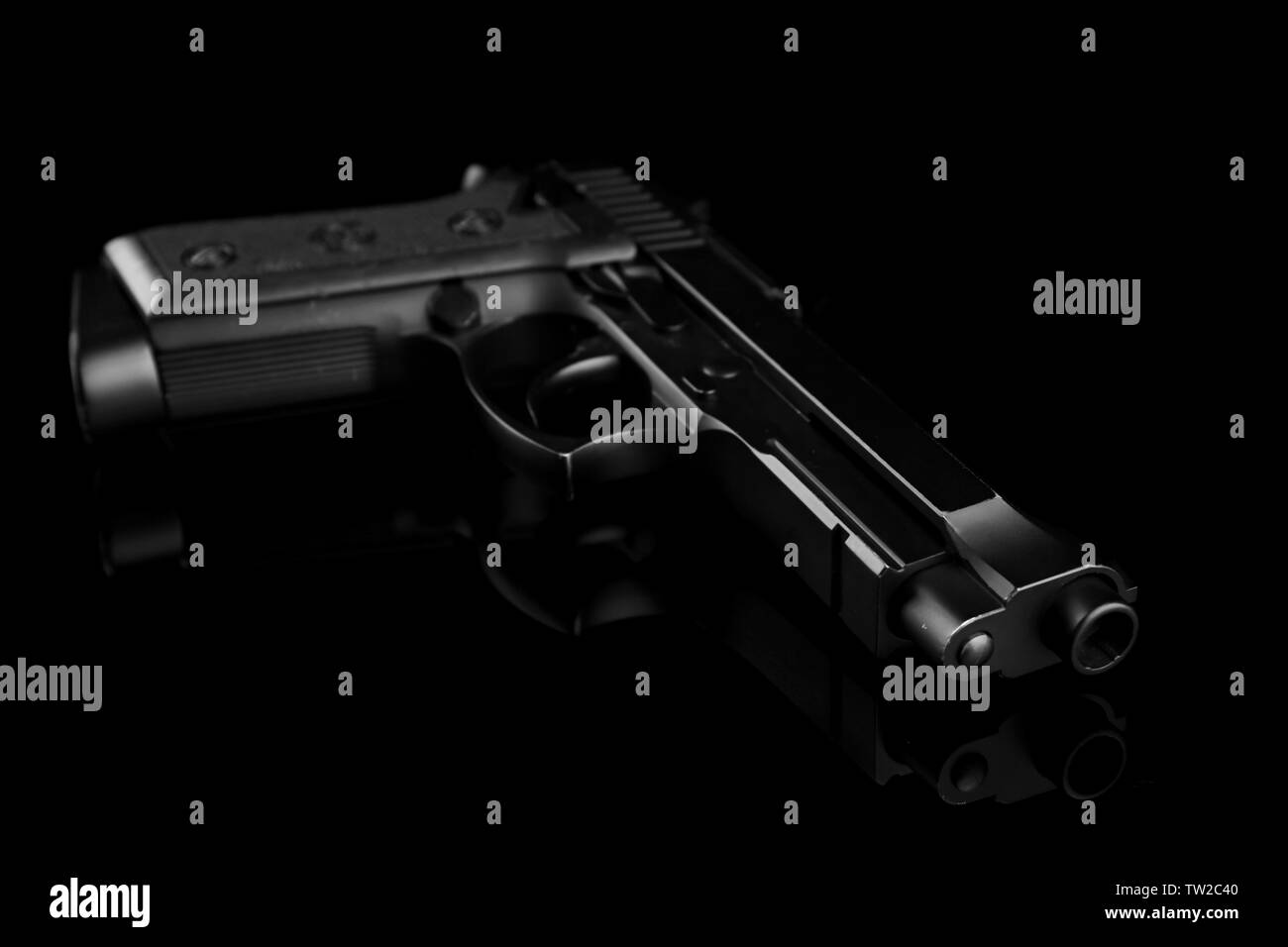 Gun on black background Stock Photo - Alamy