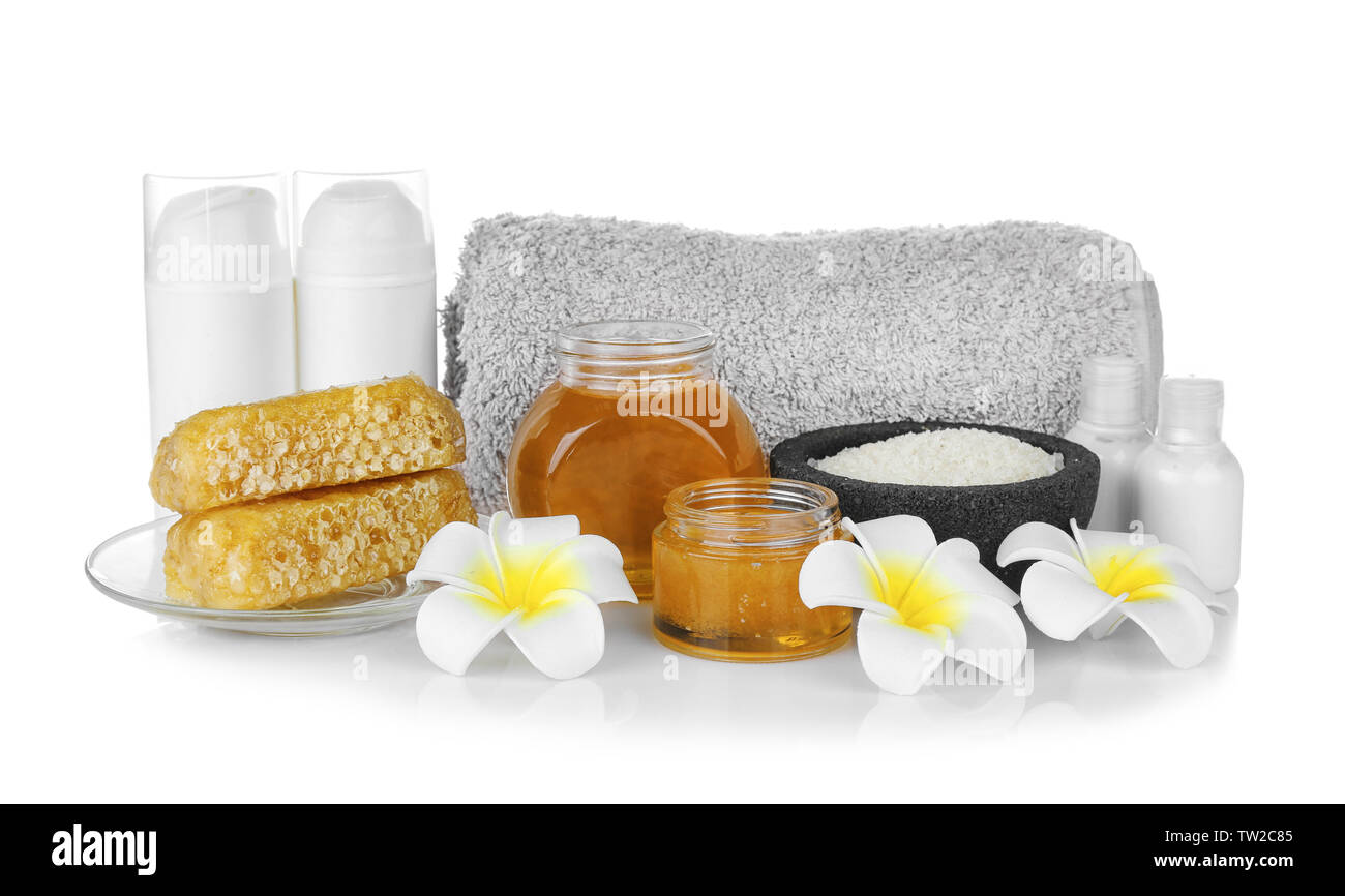Spa setting with nutrient cosmetic and delicious honey on white ...