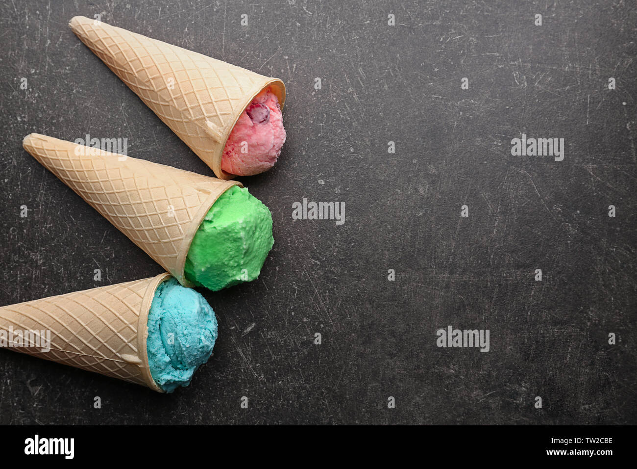 Waffle cones with colorful ice cream on table Stock Photo - Alamy