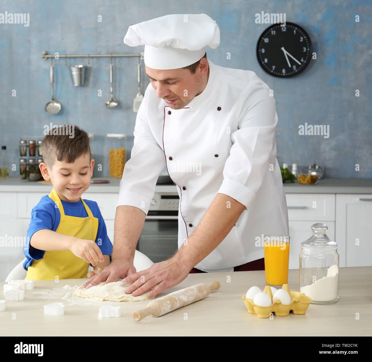 Father and son cooking together in kitchen Stock Photo - Alamy