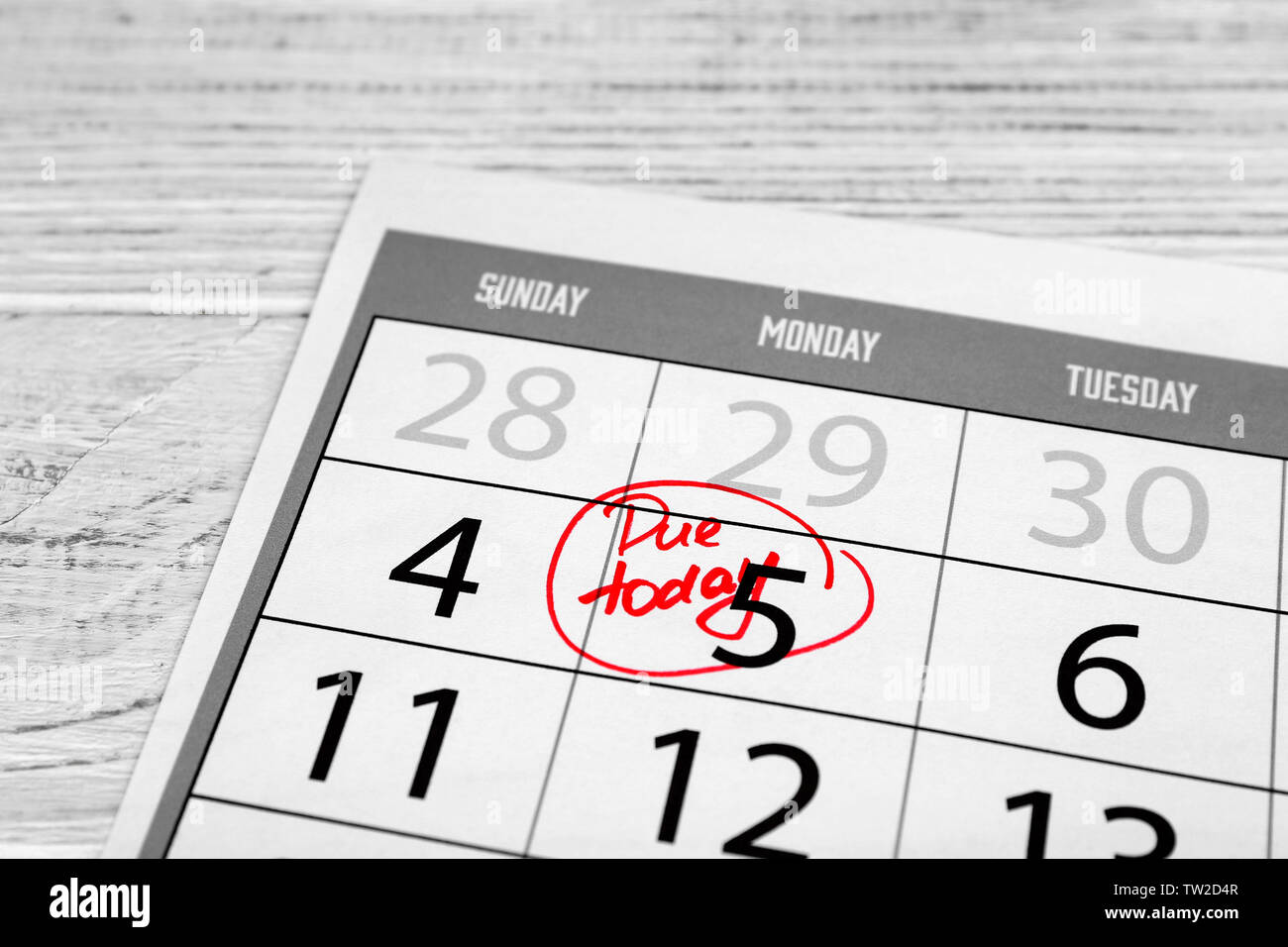 Text DUE TODAY written and circled in calendar on date, close up Stock ...