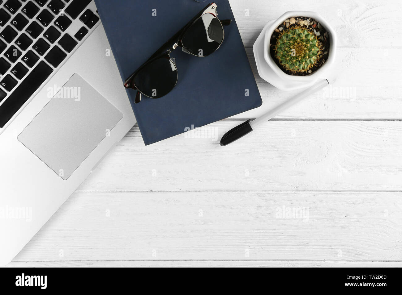 Part of stylish workspace with laptop, top view Stock Photo - Alamy